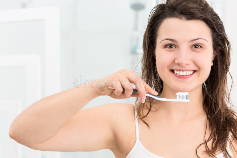 Smiling Woman Brushing Her Teeth Stock Photo - Image of medical ...