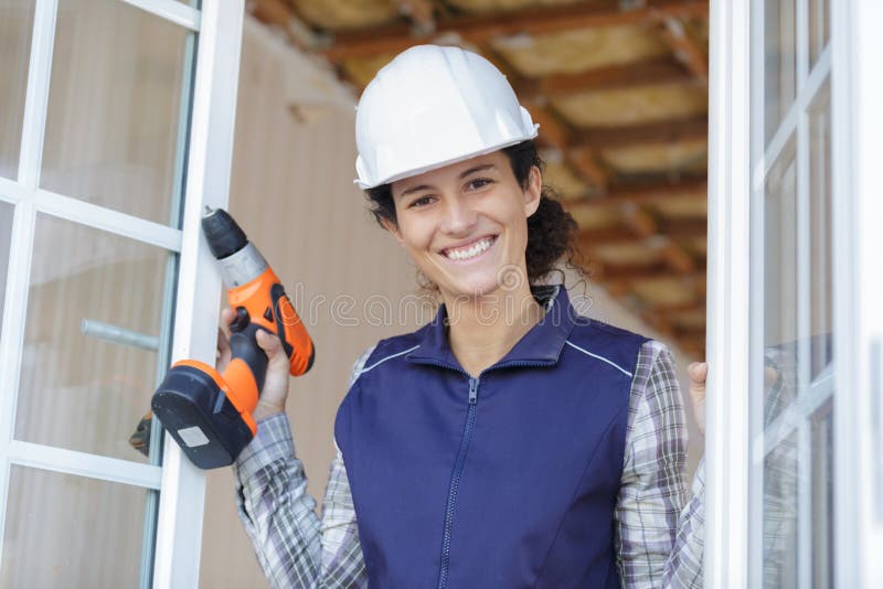 Smiling Woman Builder with Building Tool Stock Photo - Image of point ...