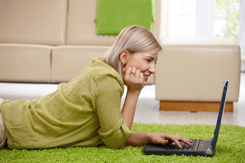 Smiling Woman with Computer at Home Stock Image - Image of european ...