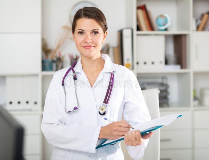 Smiling Woman Doctor Working Effectively in Office Stock Photo - Image ...