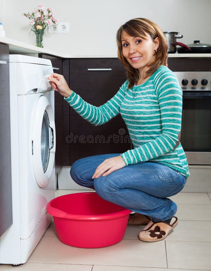 Smiling Woman Doing Laundry Stock Photo - Image of housewife, equipment ...