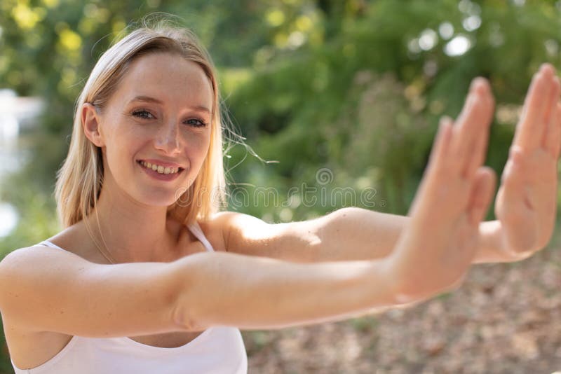 Smiling Woman Doing Yoga at Park Stock Image - Image of determination ...