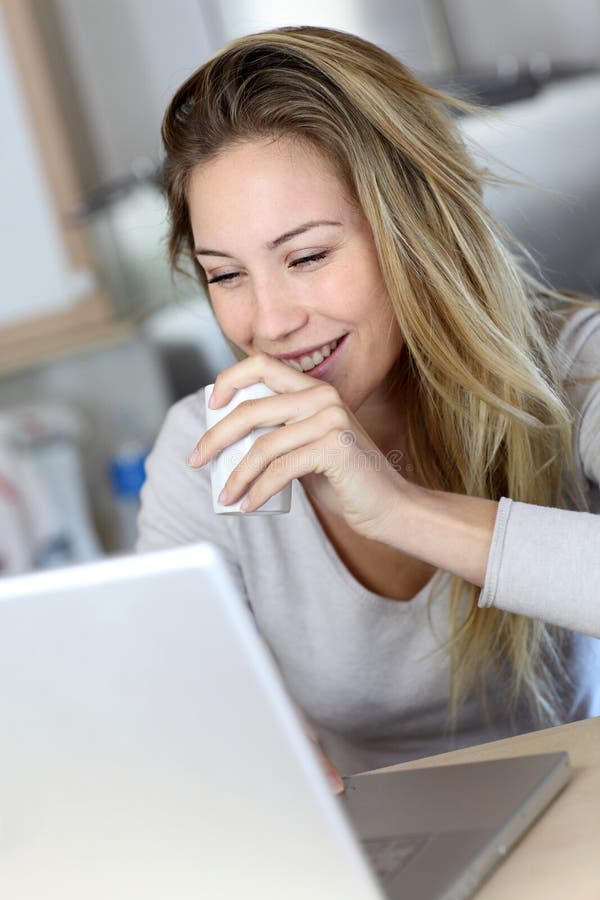 Smiling Woman Drinking Cofffee and Using Tablet Stock Photo - Image of ...