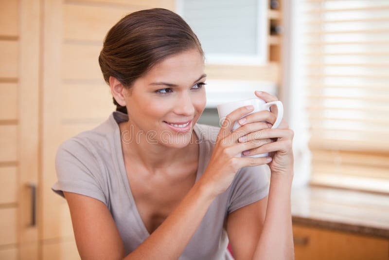 Smiling Woman Enjoying a Cup of Coffee Stock Image - Image of domestic ...