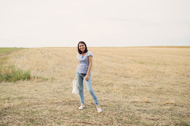 Smiling Woman in Field stock image. Image of fashion - 66021743