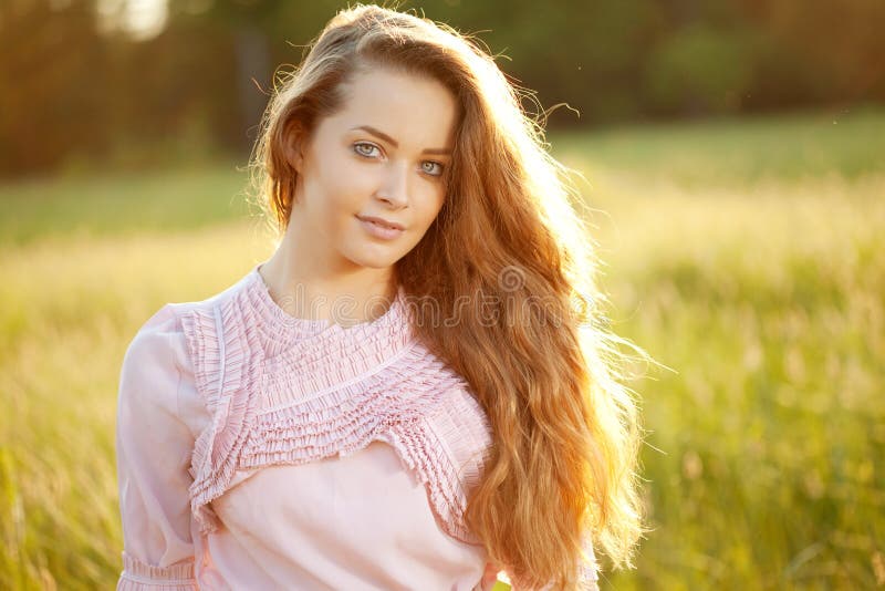 Smiling Woman in a Field at Sunset Stock Image - Image of natural ...