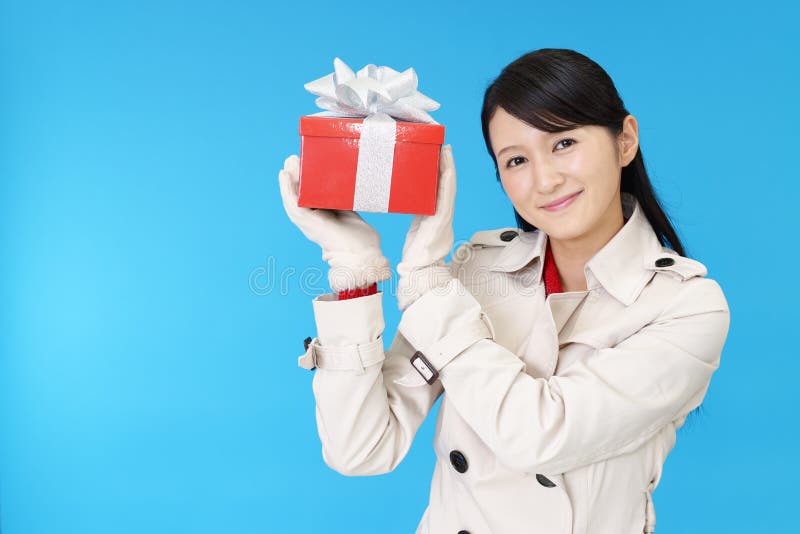 Smiling woman with a gift stock photo. Image of excited - 93399646