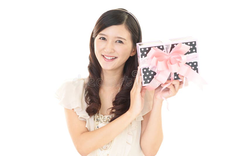 Smiling woman with a gift stock photo. Image of anniversary - 59654570
