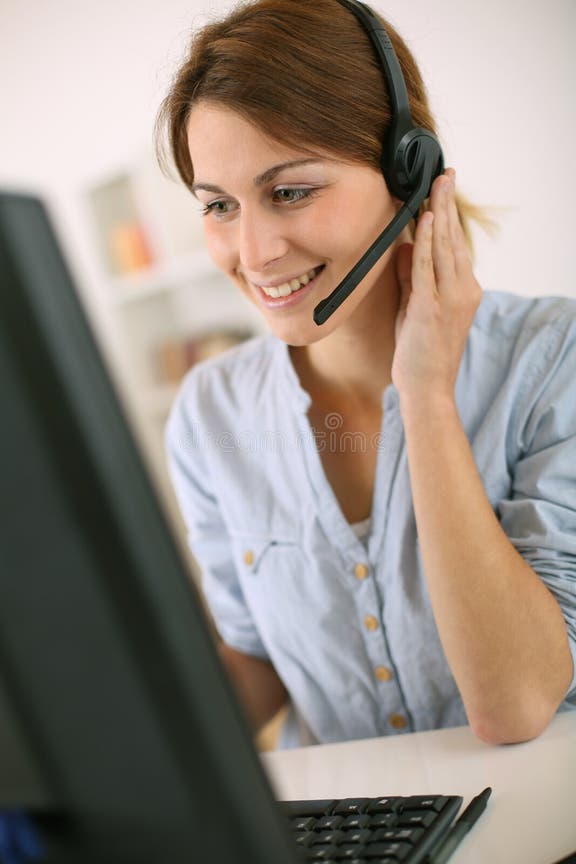 Smiling Woman with Headset Working with Computer Stock Image - Image of ...