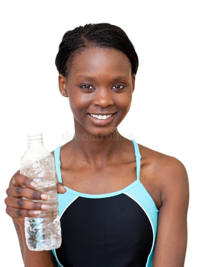 Smiling Woman Holding a Bottle of Water Stock Image - Image of floor ...