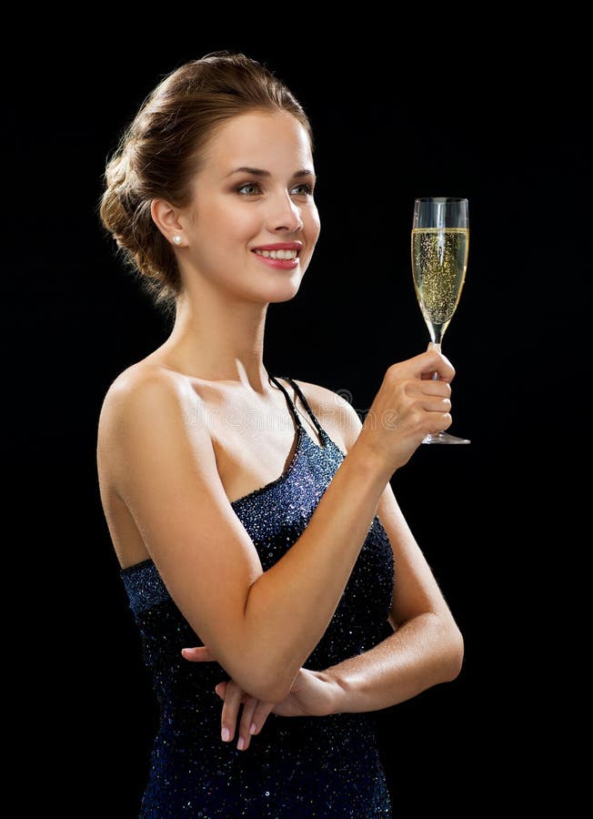 Smiling Woman Holding Glass of Sparkling Wine Stock Photo - Image of ... Smiling Woman Holding Glass of Sparkling Wine Stock Photo - Image of ...
