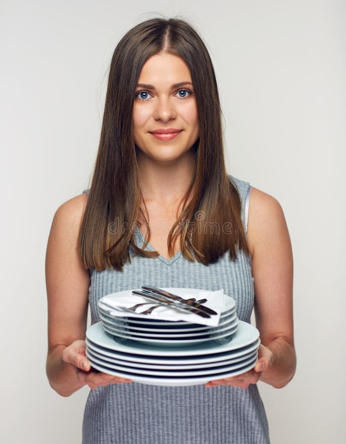 Smiling Woman Holding Stack of Plates. Stock Image - Image of smile ... Smiling Woman Holding Stack of Plates. Stock Image - Image of smile ...