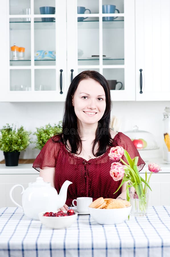 Smiling woman at home stock image. Image of flower, female - 24122193