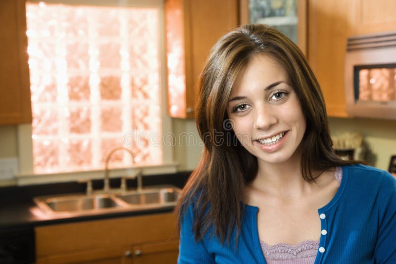 Smiling woman in kitchen stock photo. Image of pretty - 4997716