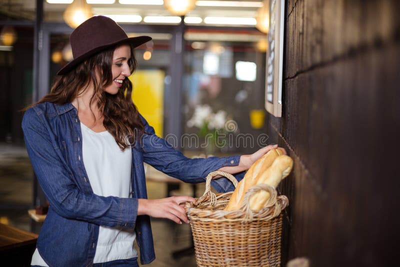 Smiling Woman Looking at Bread Stock Image - Image of client, machine ...
