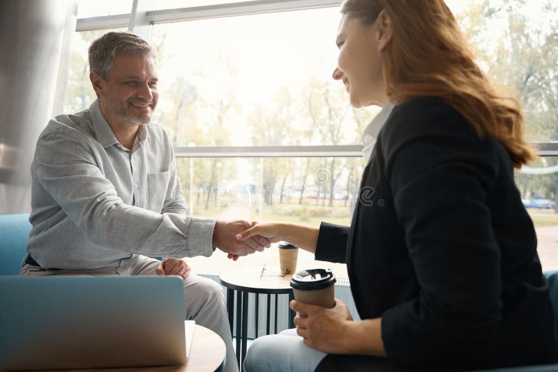 Smiling Woman and Man Shaking Hands Friendly Stock Image - Image of ...