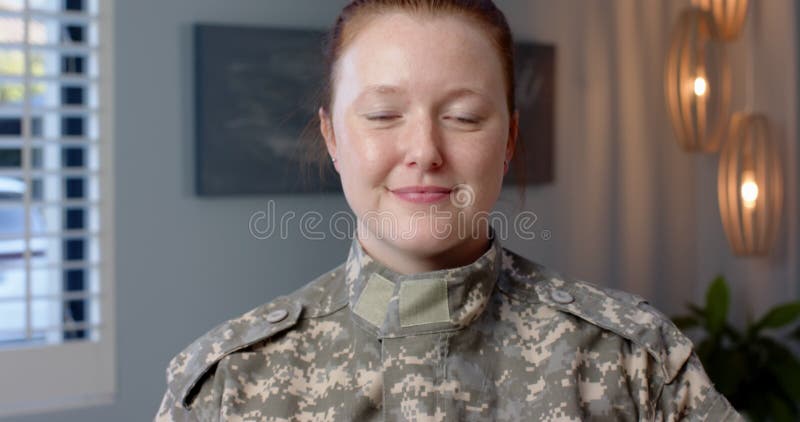 Smiling Woman in Military Uniform, Looking at Camera in Indoor Setting ...