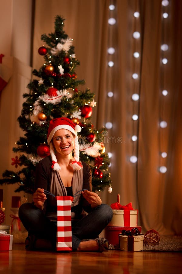 Smiling Woman Near Christmas Tree Opening Present Stock Image - Image ...