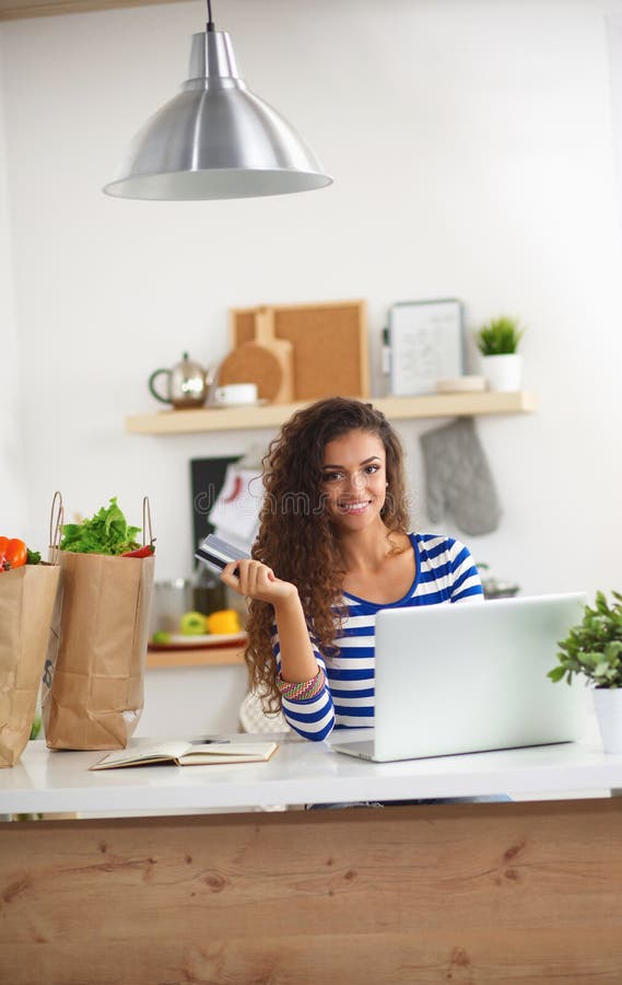 Smiling Woman Online Shopping Using Computer and Stock Photo - Image of ...