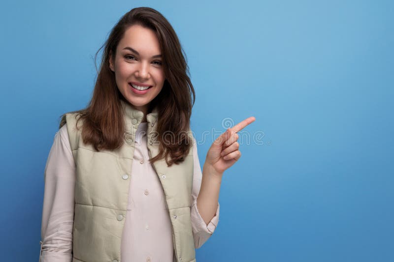Smiling Woman Pointing Finger at Empty Space on Blue Background Stock ...
