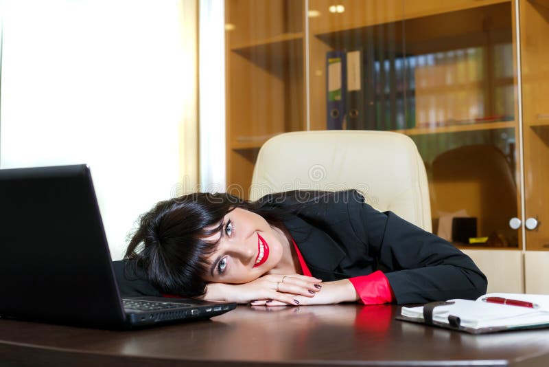 Smiling Woman Put Her Head on the Desk in Office Stock Photo - Image of ...