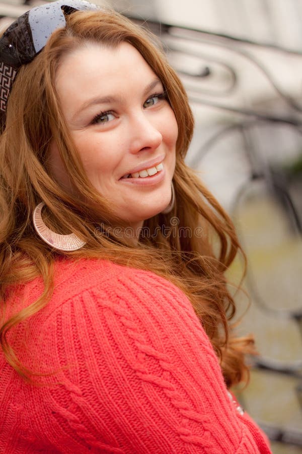 A Smiling Woman with a Red Sweater Stock Image - Image of young ...