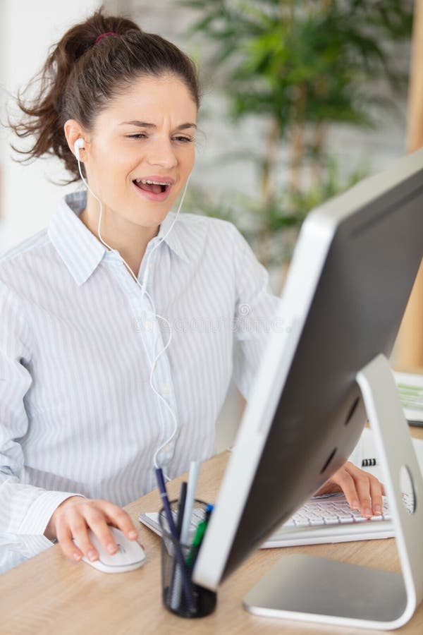 Smiling Woman Sitting At Desk In Office Stock Image Image Of Happy Woman 258798065