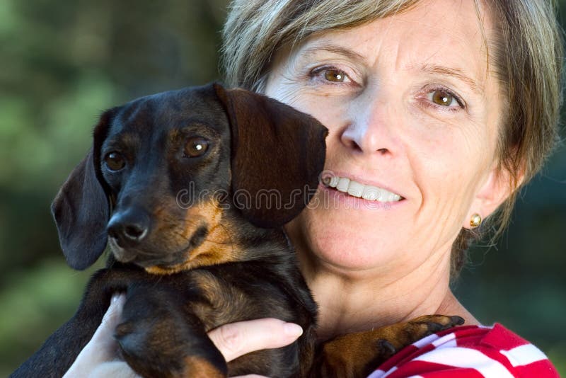 Smiling Woman and Small Dog Stock Photo - Image of mature, outdoors ...