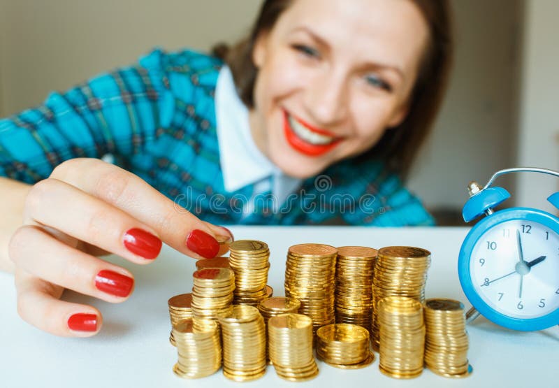 Smiling Woman Stacking Gold Coins into Columns Stock Photo - Image of ...