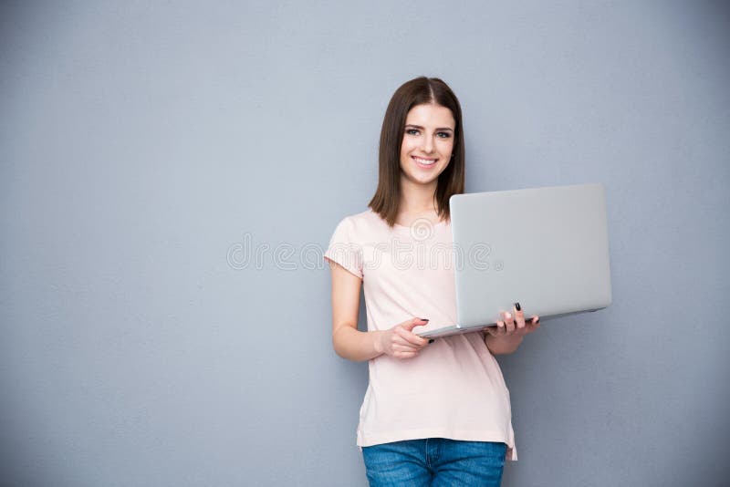 Blonde Girl with Laptop. Smiling Beautiful Woman Lying on Grass Stock ...