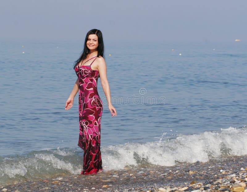 Smiling Woman Standing in Sea Waves Stock Photo - Image of active ...