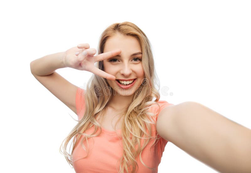 Smiling Young Woman Taking Selfie With Peace Hand Sign Stock Image