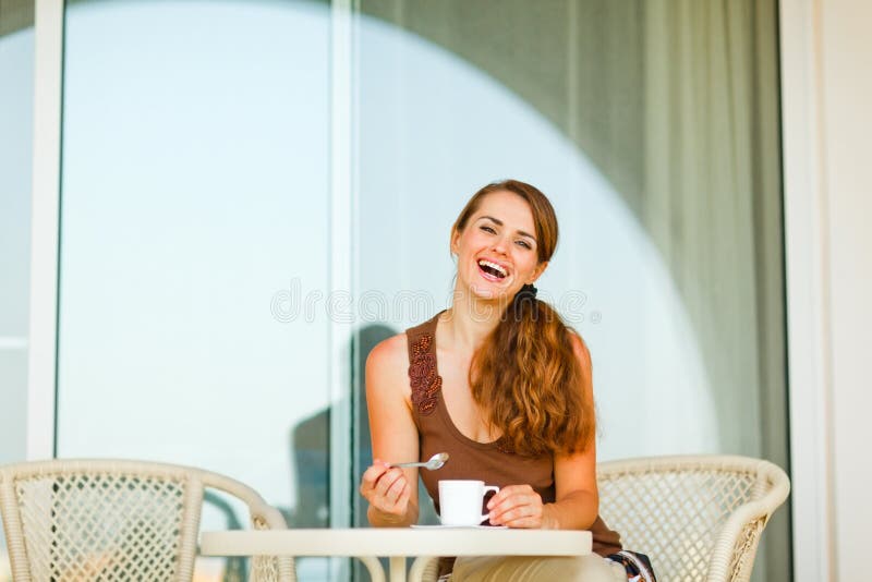 Smiling Woman on Terrace Having Cup of Tea Stock Image - Image of ...