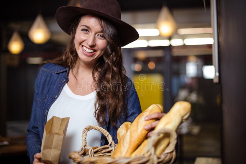 Smiling Woman Touching Bread and Looking at the Camera Stock Photo ...