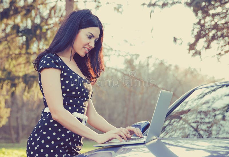 Smiling Woman Using Computer Notebook Outdoors Standing by Her Car ...