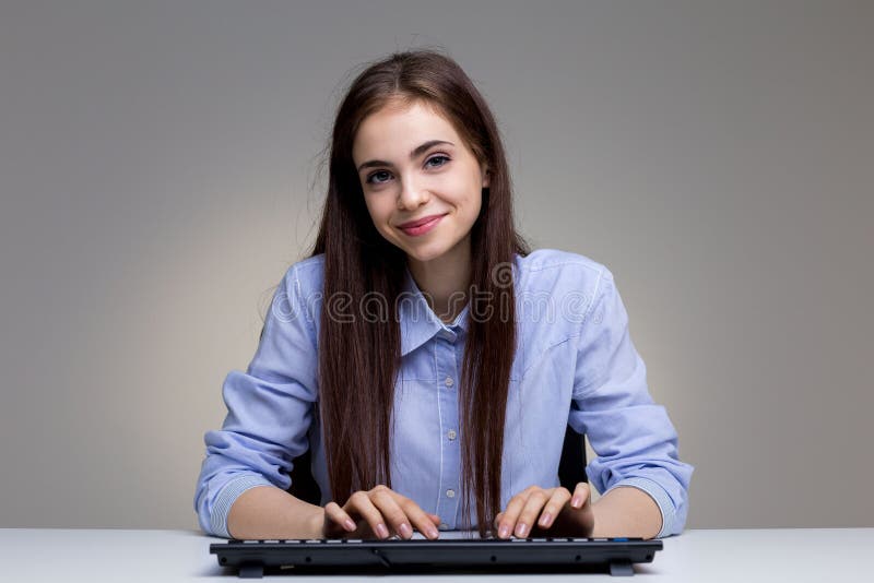 Smiling Woman Using Keyboard Stock Photo - Image of gadget, girl: 72417670