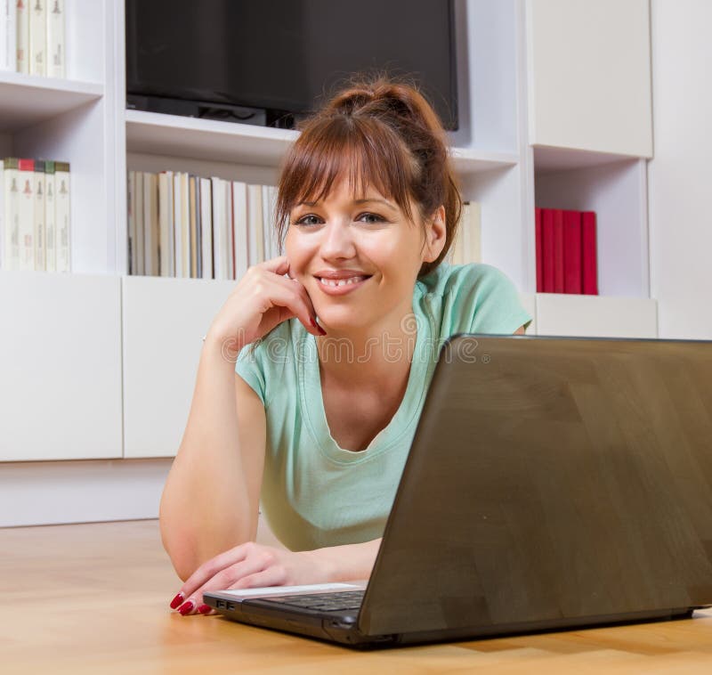 Smiling Woman Using Laptop at Home Stock Photo - Image of charming ...