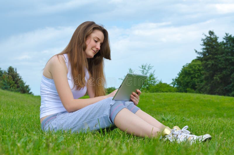 Smiling Woman Using a Tablet Stock Photo - Image of research, person ...