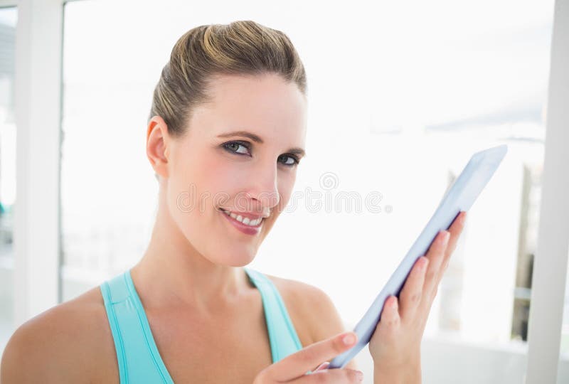Smiling woman using tablet stock photo. Image of camera - 33841248