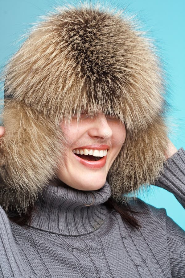 Smiling Woman Wearing Fur-cap Stock Image - Image of beautiful, happy ...