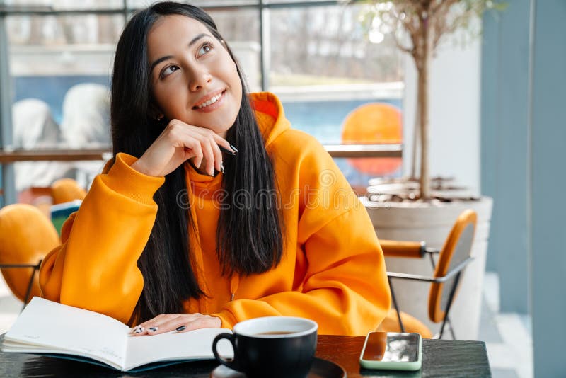 Smiling Woman Writing Down Notes while Sitting in Cafe Stock Image ...