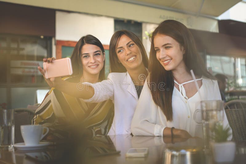 Smiling Women Taking Selfie Together Outdoors Stock Image Image Of