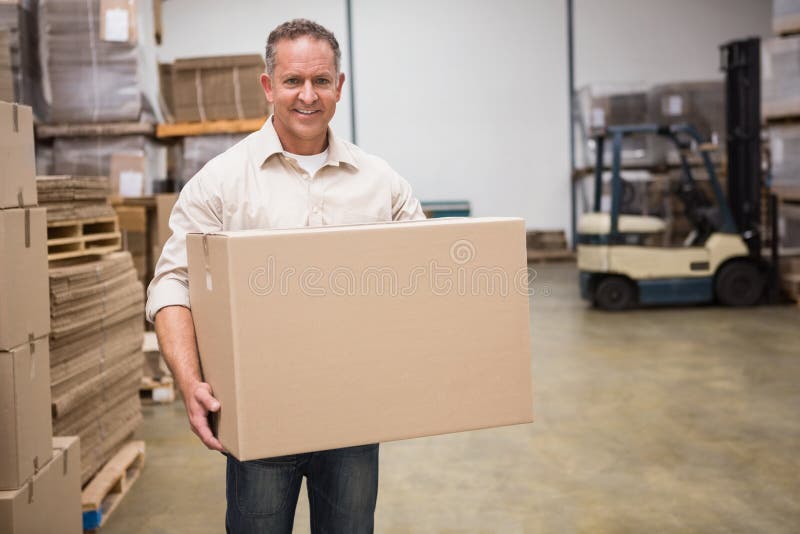 Smiling Worker Carrying a Box Stock Image - Image of happy, industrial ...
