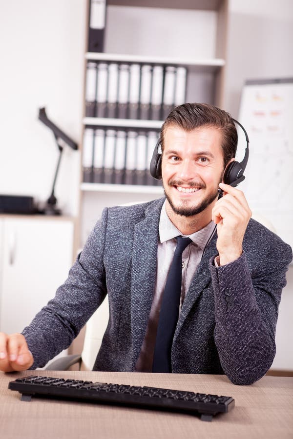 Smiling Worker from Customer Service Support in the Office Stock Photo ...