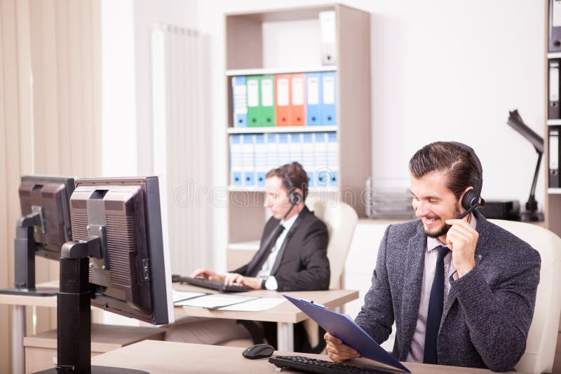 Smiling Worker from Customer Service Support in the Office Stock Photo ...