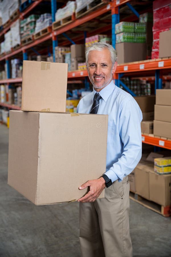 Smiling Worker Holding Boxes Stock Image - Image of look, looking: 77696653