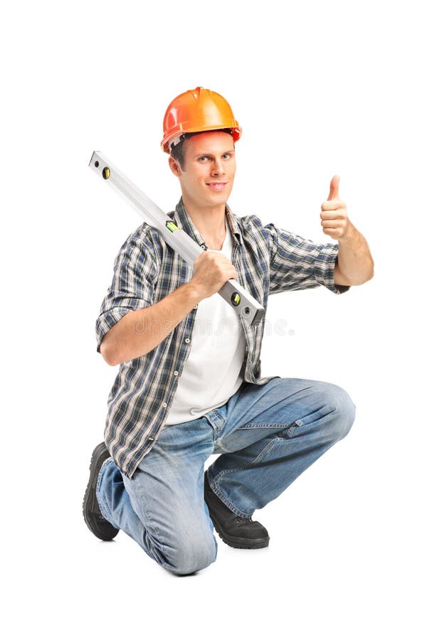 A Smiling Worker Holding a Construction Bubble Level and Giving Stock ...