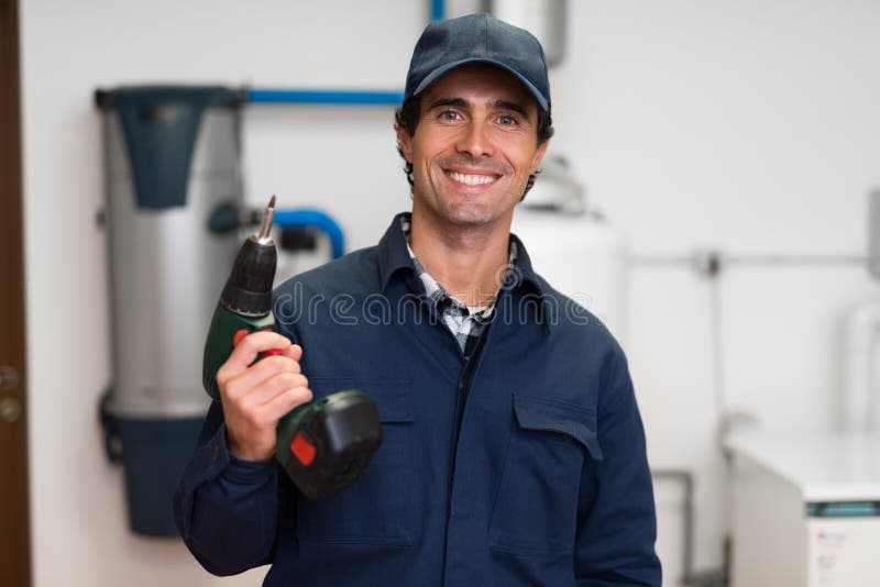 Smiling Worker Holding a Screwdriver Stock Image - Image of contract ...