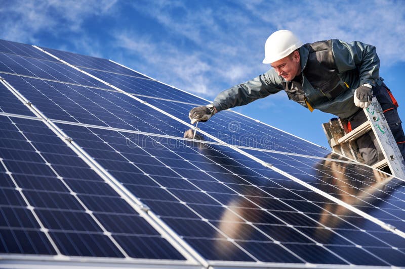 Smiling Worker Installing Solar Panel Under Cloudy Sky. Stock Image ...