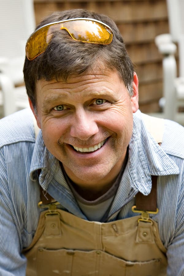 Happy smiling worker man stock image. Image of safety - 10181825